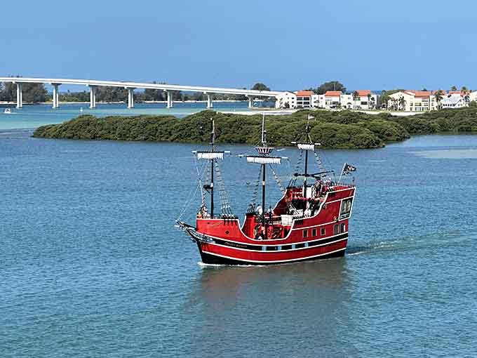 That classic pirate ship silhouette against the blue sky looks like it sailed straight out of a storybook.