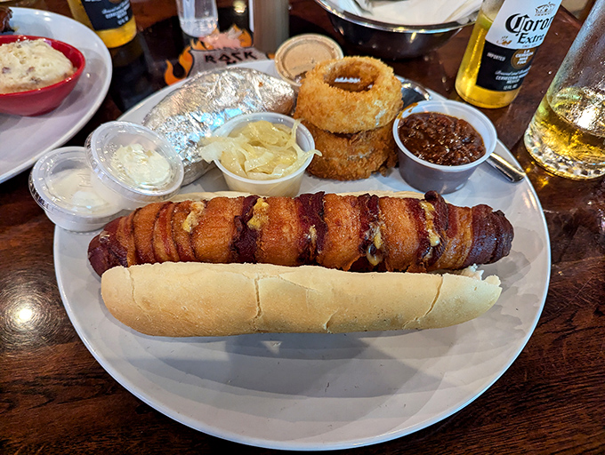 The bacon-wrapped hot dog is culinary excess worthy of a stadium rock show – indulgent, over-the-top, and absolutely necessary.