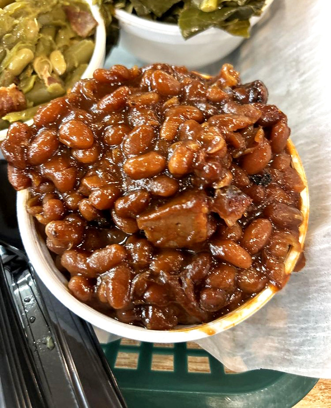 These aren't your cafeteria baked beans &ndash; they're a sweet, savory symphony with bits of meat conducting the flavor orchestra.