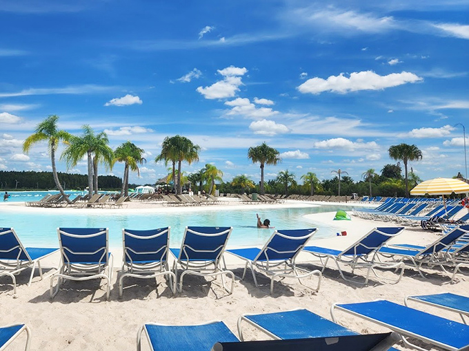 Beach Lounge Chair Area Yellow umbrellas stand like cheerful sentinels guarding against Florida's enthusiastic sunshine.