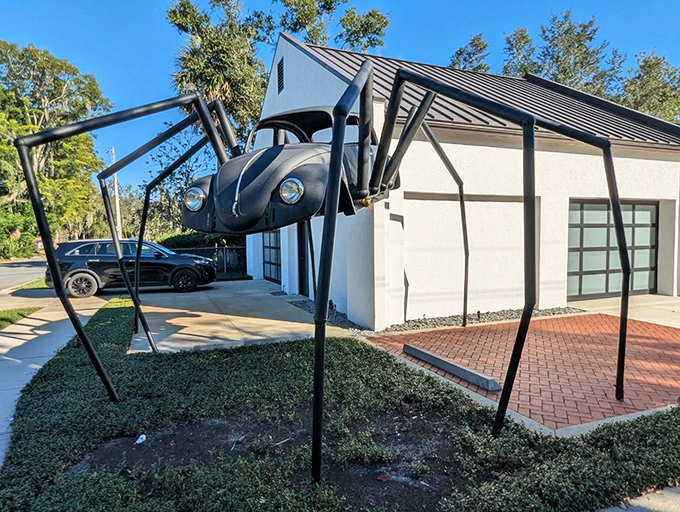 The stark contrast between the pristine white building and the menacing black spider creates a visual punch that photographers love.