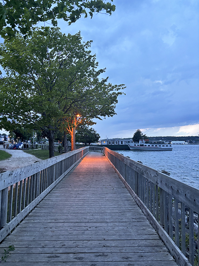 As evening settles in, the illuminated pathway glows with possibility – like a runway leading to your next great memory.