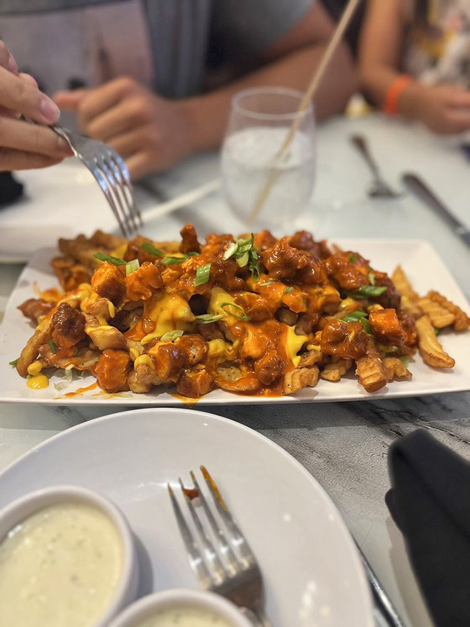 Buffalo chicken fries deliver a spicy punch that cuts through the sweetness permeating the air &ndash; savory salvation in a sugar kingdom.