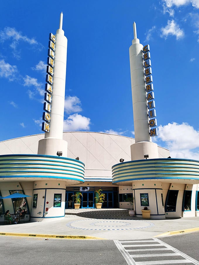 The Celebration cinema stands like a retro-futuristic beacon, promising air-conditioned escape when Florida's heat gets serious.