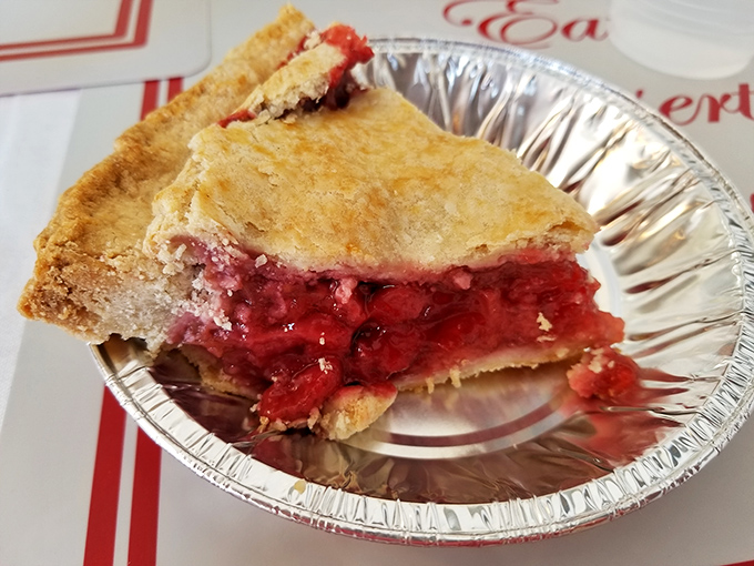 Ruby-red cherries peek through the perfectly vented crust, promising a sweet-tart explosion that will transport you to summer orchards.