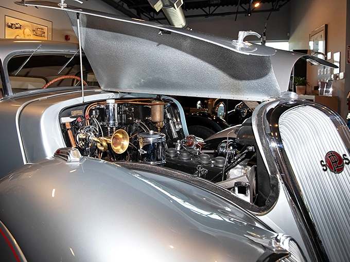 Peek under the hood of history &ndash; this vintage engine compartment reveals the mechanical heart that once powered dreams down open roads.