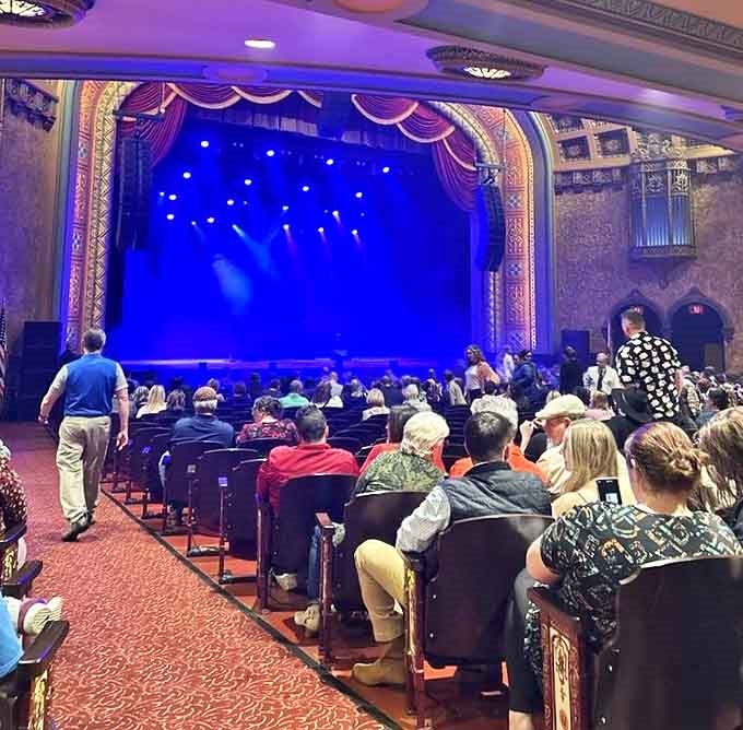 The audience settles in with anticipation, unaware they might be sharing the evening with the theater's famous ghostly projectionist who never misses a show.