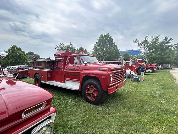 This workhorse Ford F-750 fire truck rests between calls, its weathered paint telling stories of decades of faithful service.