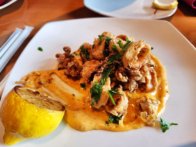 Golden rings of perfectly crisp calamari that would make even the Kraken proud &ndash; no rubbery disappointments in this mythological realm.