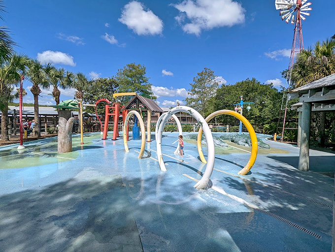Kids splash through colorful water features where the only gators present are the friendly, non-bitey kind made of painted metal.