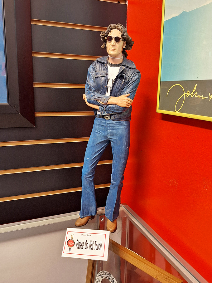 This figure stands in silent tribute, denim-clad and instantly recognizable even without seeing the face.