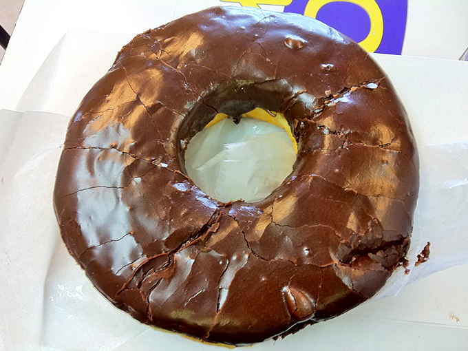 The chocolate donut's glossy exterior promises and delivers an intense cocoa experience that would make Willy Wonka jealous.