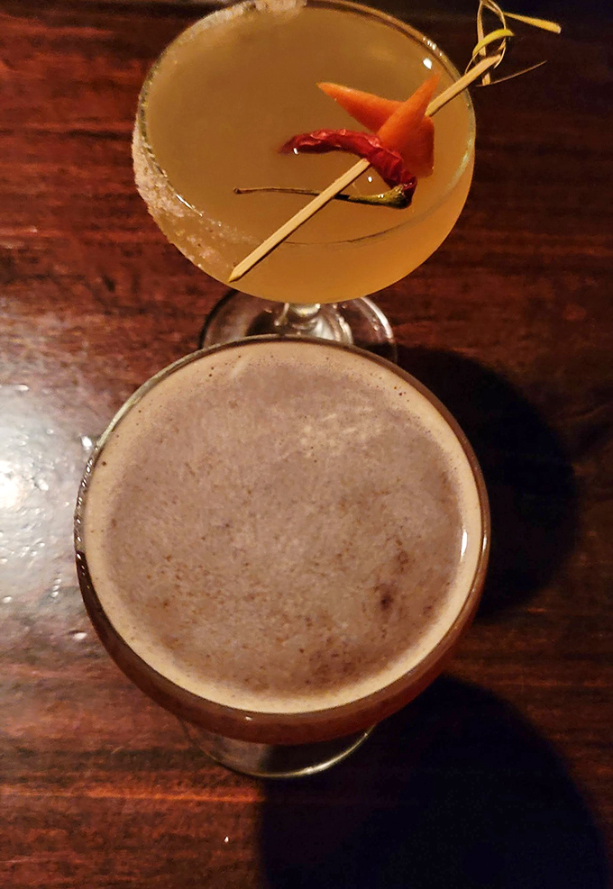 Martini: Amber-hued cocktail garnished with carrot and chili &ndash; proof that vegetables can party too when invited to the right glass.