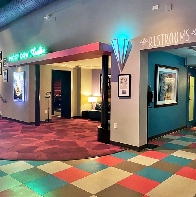 Restrooms gets the Art Deco treatment with stylish signage that proves even the necessities deserve a touch of theatrical flair.