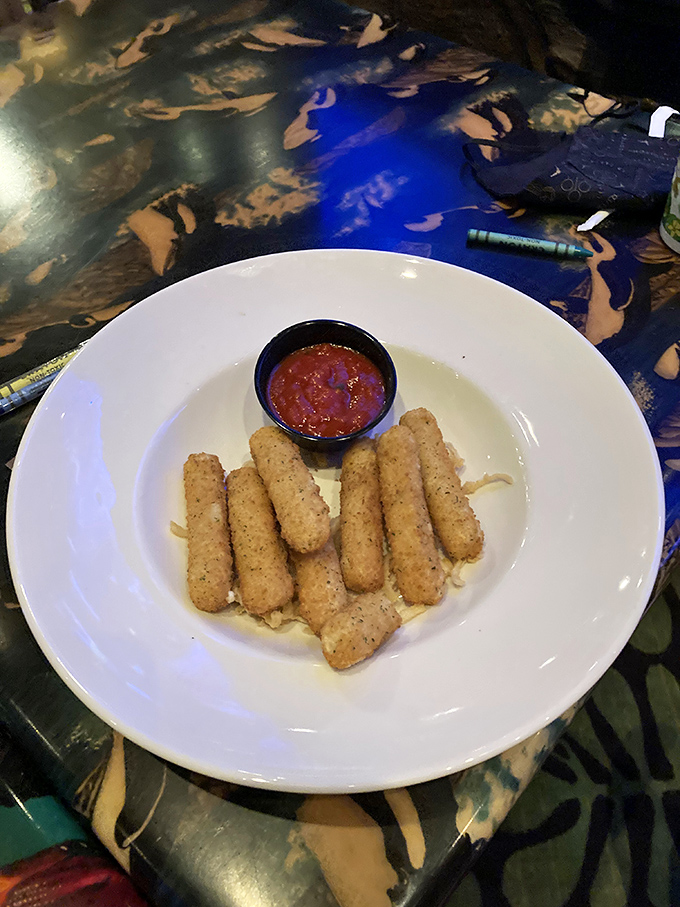 These aren't your average mozzarella sticks, they're jungle-sized cheese vessels that stretch dramatically with each bite, perfect for Instagram food pulls.