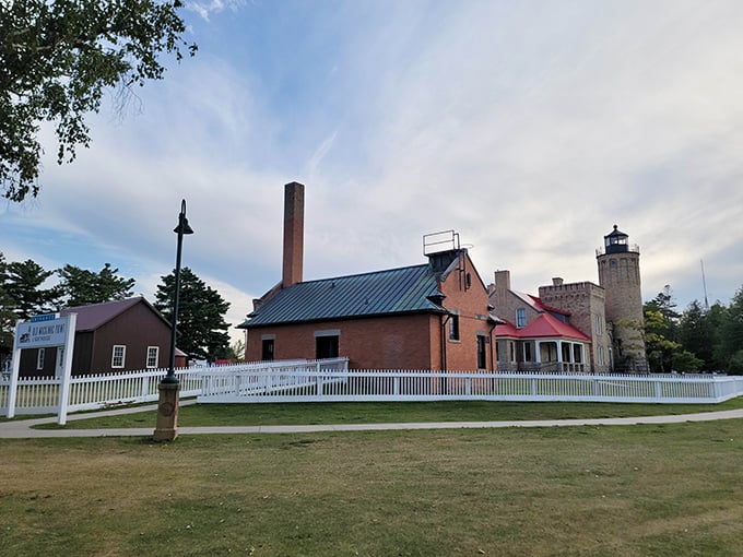 Historic buildings stand quietly beneath the open sky, offering a peaceful glimpse into the past as evening approaches.