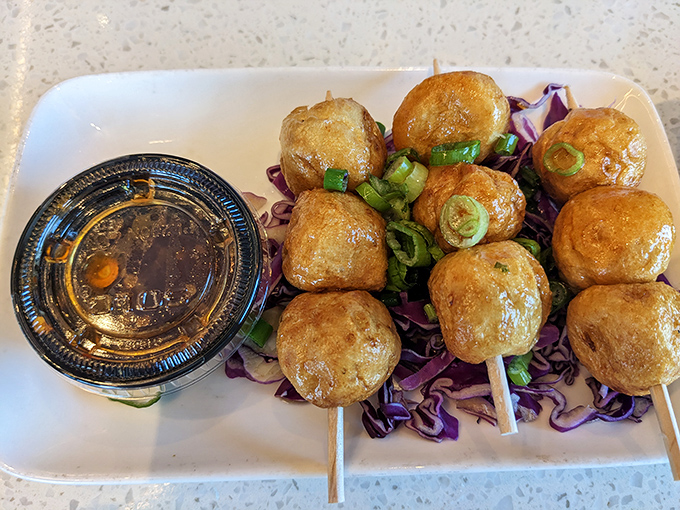 Golden-fried Oden Balls on skewers &ndash; the kind of street food that makes you stop mid-conversation and say, "What was I talking about again?"