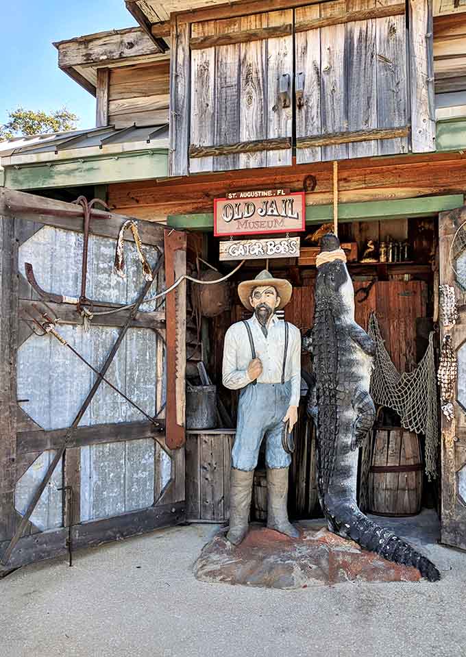The rustic Old Jail entrance features a weathered wooden fa&ccedil;ade, complete with a mannequin and alligator that set the tone for this unusual museum.