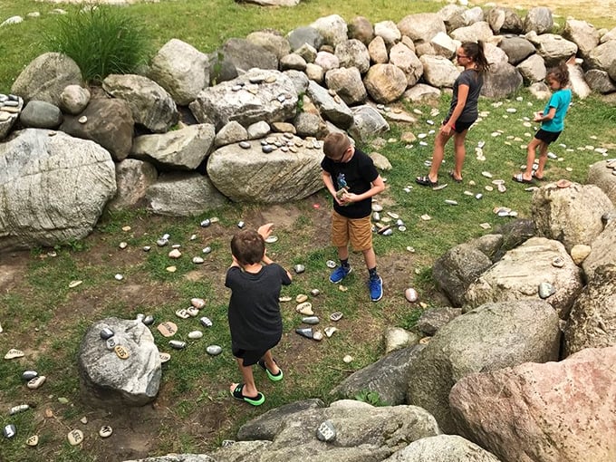 Stone gathering area where visitors can pause to contemplate life's big questions or just rest their feet between purple adventures.