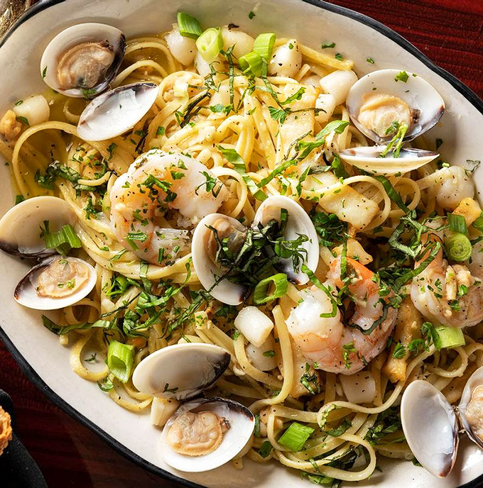 Seafood Pasta: The ocean's finest treasures play hide-and-seek among perfectly al dente linguine &ndash; a dish worth rolling up your sleeves for.