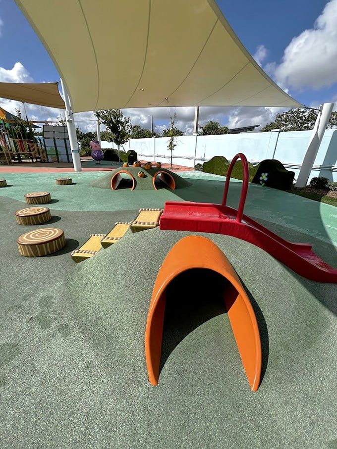 Colorful tunnels and slides invite little adventurers to crawl, climb and explore – a playground paradise where imagination runs as wild as the children.