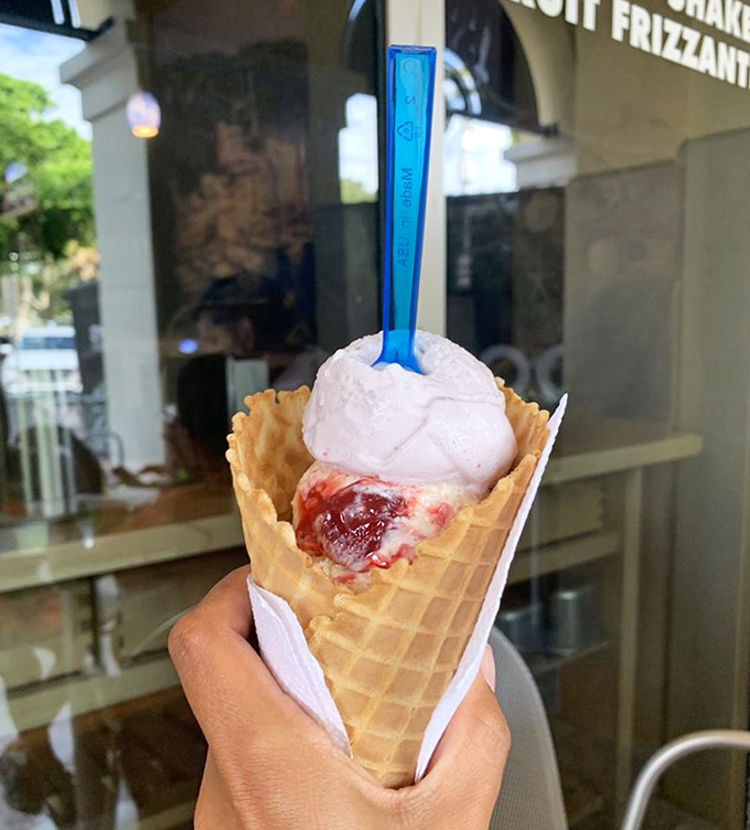 That strawberry cheesecake gelato in a classic waffle cone is summer distilled into frozen form – notice how the real strawberry swirls through creamy cheesecake base.