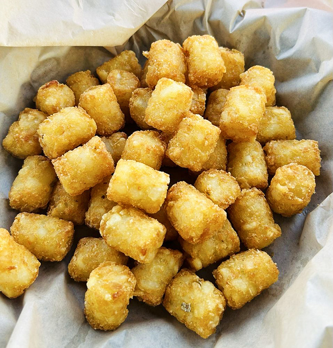 Golden tater tots that take you back to childhood but with grown-up execution &ndash; crispy outside, fluffy inside, and utterly addictive.