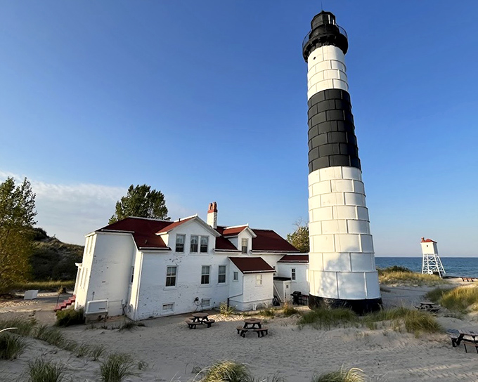Those distinctive black and white stripes aren't just fashionable, they're practical daymarks that help sailors identify this specific lighthouse from miles away.