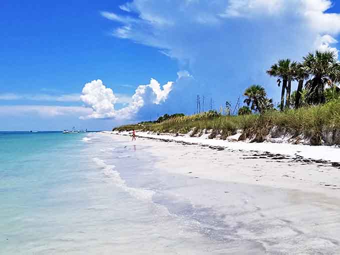 Where gentle waves kiss powdery white sand under an impossibly blue sky – no reservations or resort fees required.