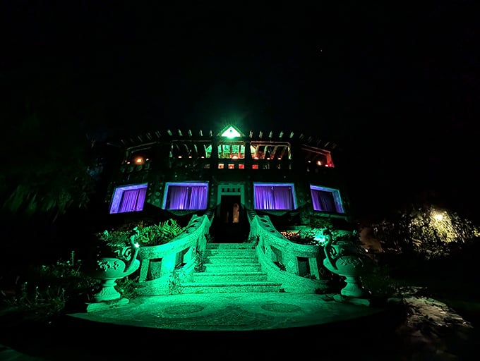 Illuminated like a haunted attraction's dream venue, the Wonder House at night proves good bones look gorgeous in any lighting.