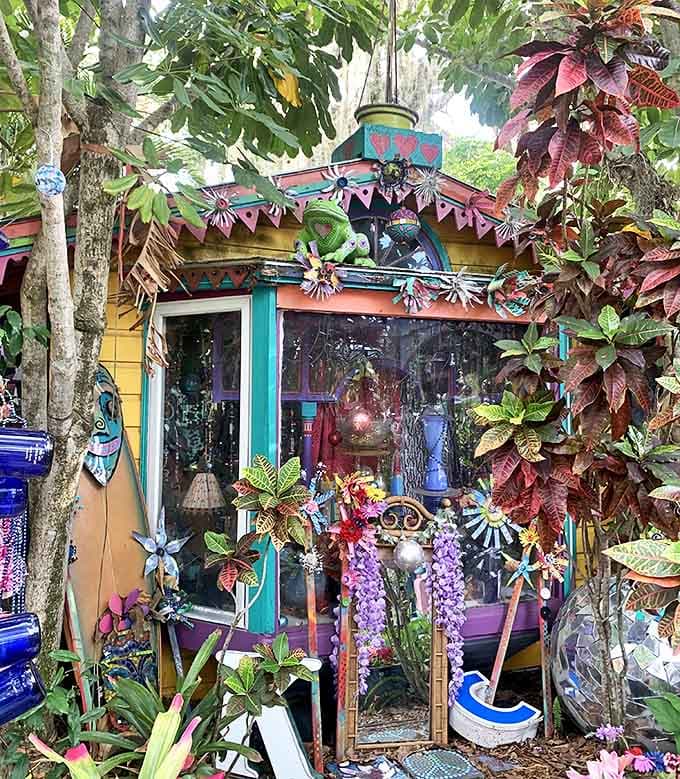 A boat filled with colorful bowling balls seems to have sailed in from some psychedelic sea, anchored permanently in creativity.