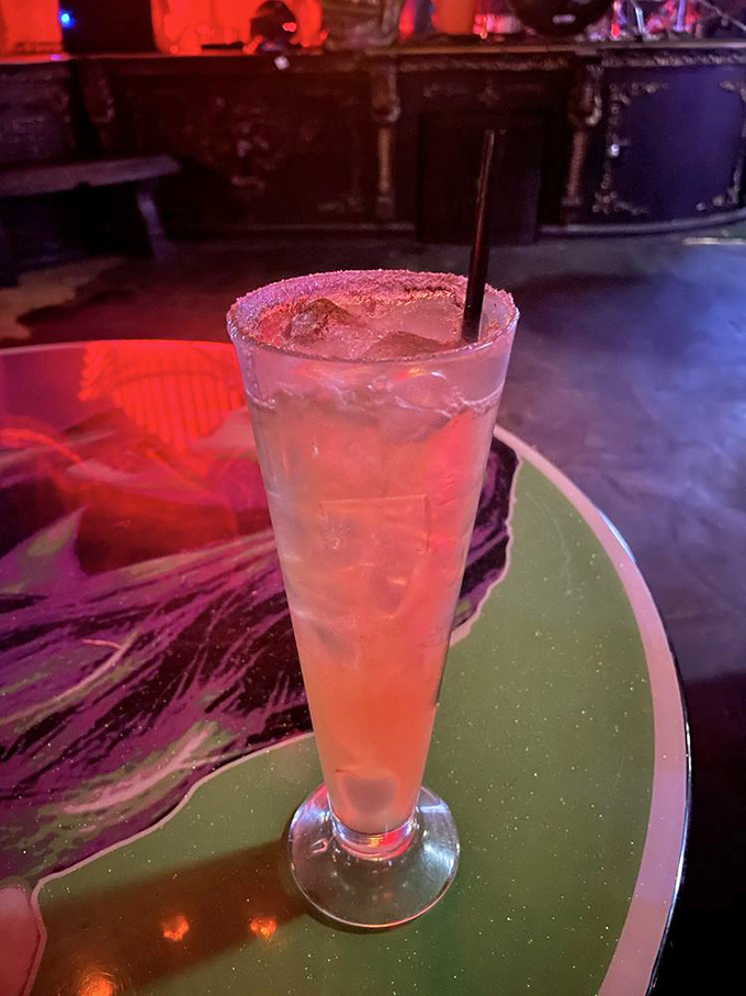 This smoky concoction might be the "Witches Brew," served in a glass that seems to capture the very essence of a potion master's most prized elixir.