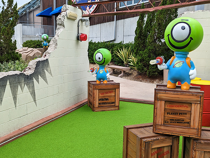 These wide-eyed extraterrestrial observers judge your putting technique with a mix of amusement and scientific curiosity.