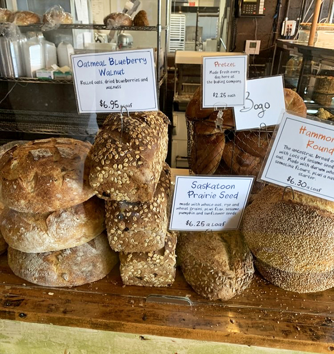 Artisan loaves lined up like edible sculptures – their crusts crackling with promise and interiors waiting to soak up butter, soup, or life's problems.