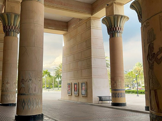 Sunlight streams through the columned entrance, creating dramatic shadows worthy of a Spielberg opening sequence.