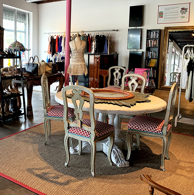 Elegant dining chairs surround a substantial wooden table, looking like they came straight from a home d&eacute;cor magazine rather than a thrift store &ndash; dinner party dreams at donation prices.