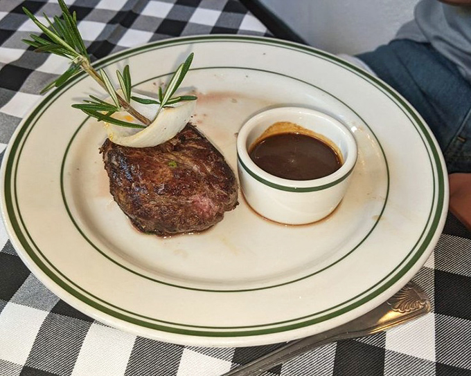 A perfect plate: stone crab claws accompanied by hash browns that achieve the ideal crispy-outside-tender-inside balance and creamed spinach that would make any steakhouse jealous.