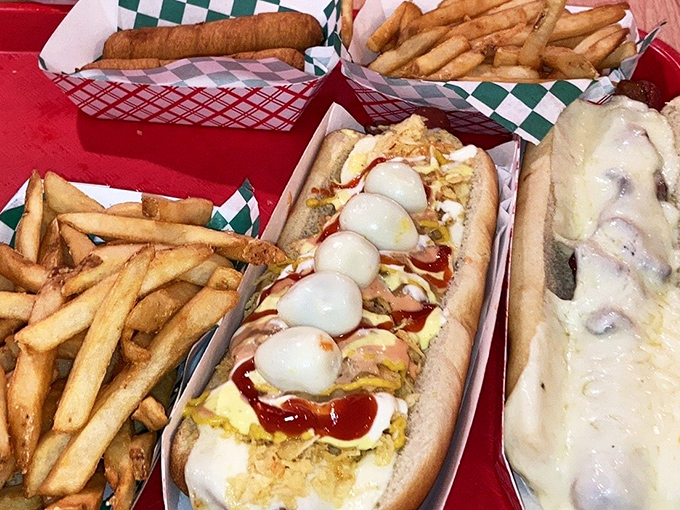 A hot dog fiesta with French fries as backup dancers. This spread isn't just a meal&mdash;it's a celebration on a checkered paper.