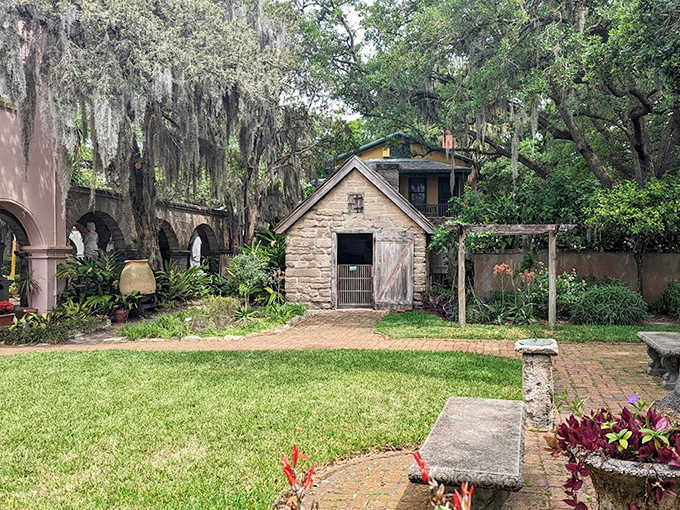 The tranquil garden offers a moment of serenity, where stone pathways wind through greenery that has seen centuries come and go.
