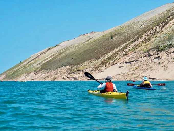 Paddling these crystal-clear waters offers a different perspective on the dunes, assuming the wind cooperates with your plans.