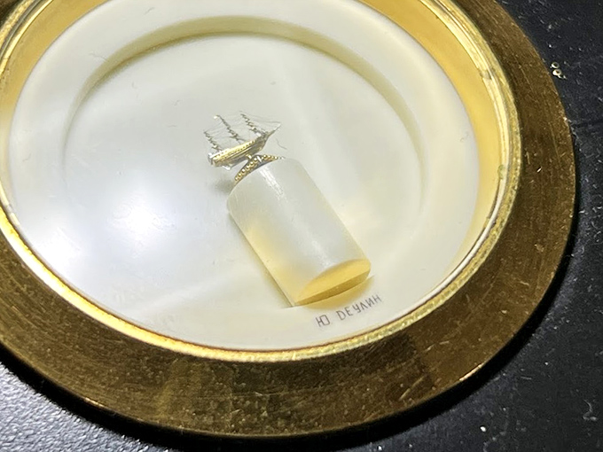 This microscopic sailing ship, painted inside a tiny glass tube, demonstrates the extraordinary patience and precision required for micro-art.