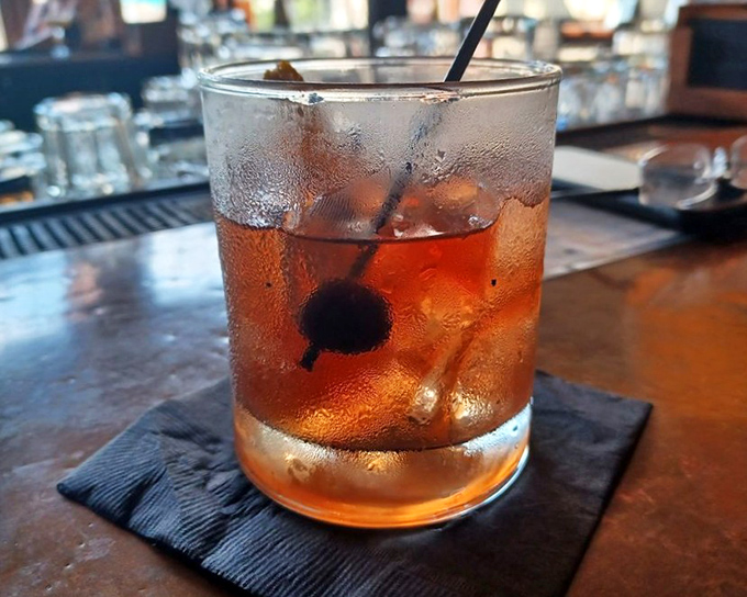 Smoke dances above this Old Fashioned like spirits from the Prohibition era giving their approval to modern craftsmanship.
