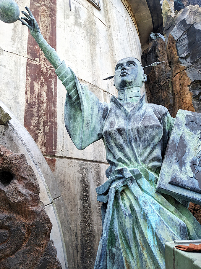 A stoic statue stands sentinel, its weathered patina suggesting centuries of watching over Dok-Ondar's precious collection of antiquities.