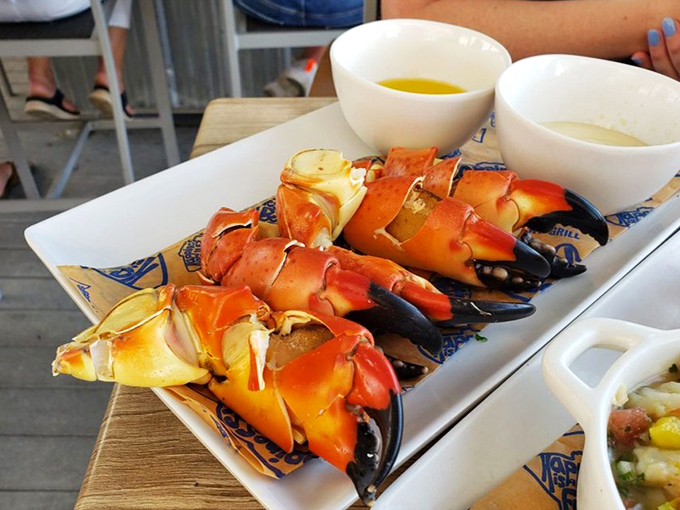 The perfect bite of Florida on a plate: stone crab claws with their signature mustard sauce, a combination that makes taste buds stand up and applaud.