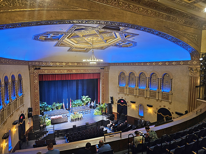 From the balcony, the theater reveals itself as a symmetrical masterpiece where every seat offers a perfect view of celluloid dreams.