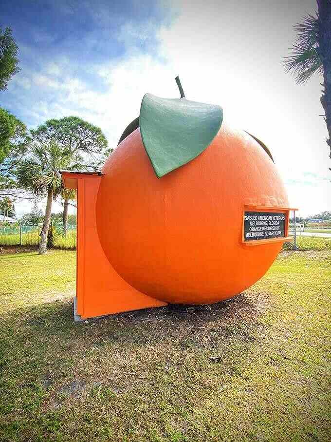 The Big Orange stands as a bright, round tribute to Florida's famous citrus industry, impossible to miss against the blue sky.