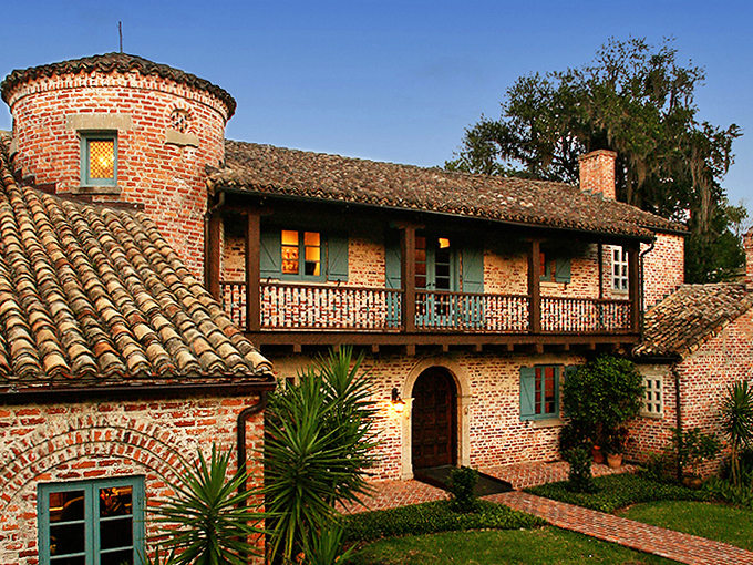 Casa Feliz brings Spanish countryside charm to Winter Park, its rustic brick exterior and barrel-tile roof creating a timeless escape.