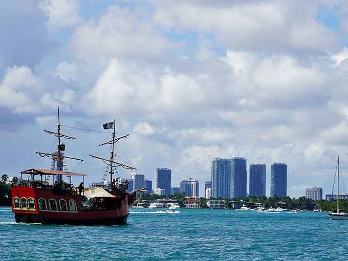 The downtown Miami skyline behind this pirate ship creates a hilarious contrast between old and new.