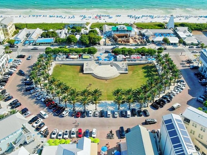 A palm-lined town square with a central amphitheater opens directly onto Seaside&rsquo;s white-sand shoreline, creating a vibrant gathering place between the community and the Gulf.