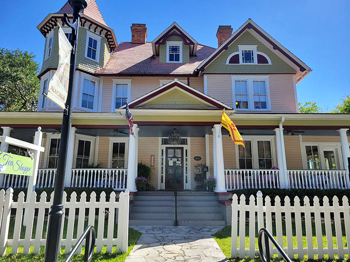 Teatime Tranquility's historic stone archway entrance, adorned with seasonal wreaths, looks plucked from a storybook village.
